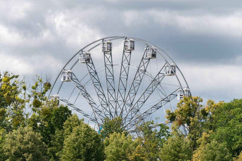 View of Ferris Wheel between Trees Stock Image - Image of entertainment ...
