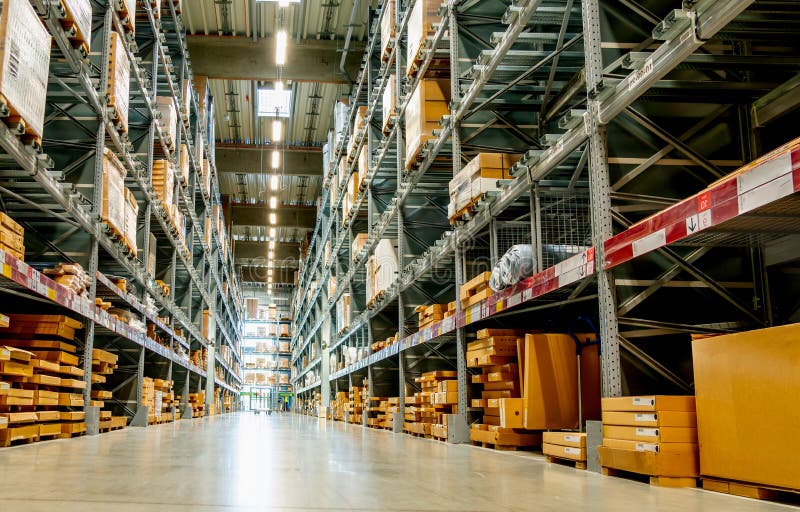 View from the Floor in a Large Warehouse in the Aisle between the ...