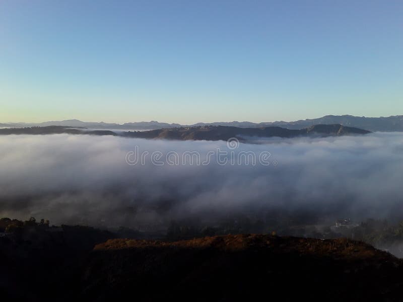 A View of Fog Rolling in the Valley at Dawn Stock Image - Image of ...
