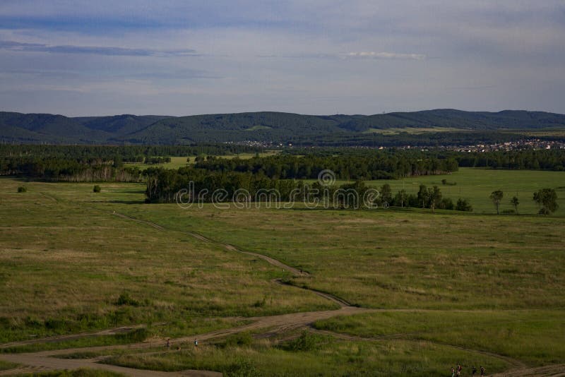 View of the Forest in the Distance, Mountains and Meadow Stock Photo ...