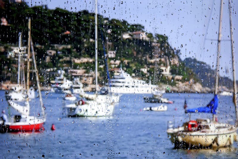 View on the French Coast with Yachts through the Glass Stock Photo ...