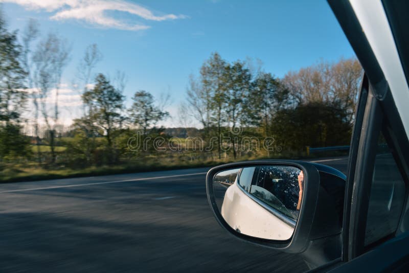 Side View Mirror of a Moving Car Stock Photo - Image of windshield ...