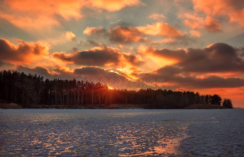View from the Frozen Lake at Sunset in the Winter Forest. Stock Image ...