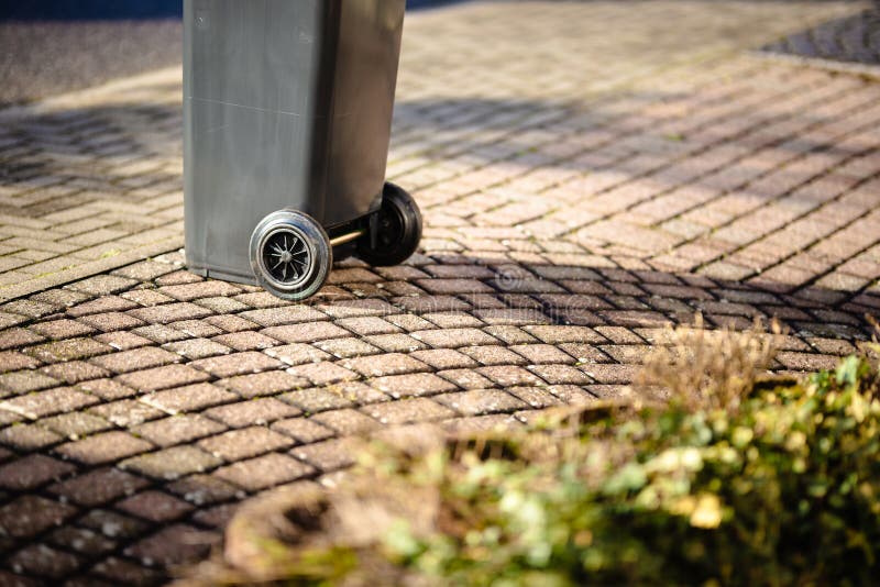 View of a Garbage Container on the Street Pavement Stock Photo - Image ...