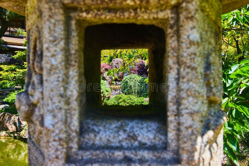 View of Garden with Mini Waterfall Seen through Japanese Stone Lantern ...