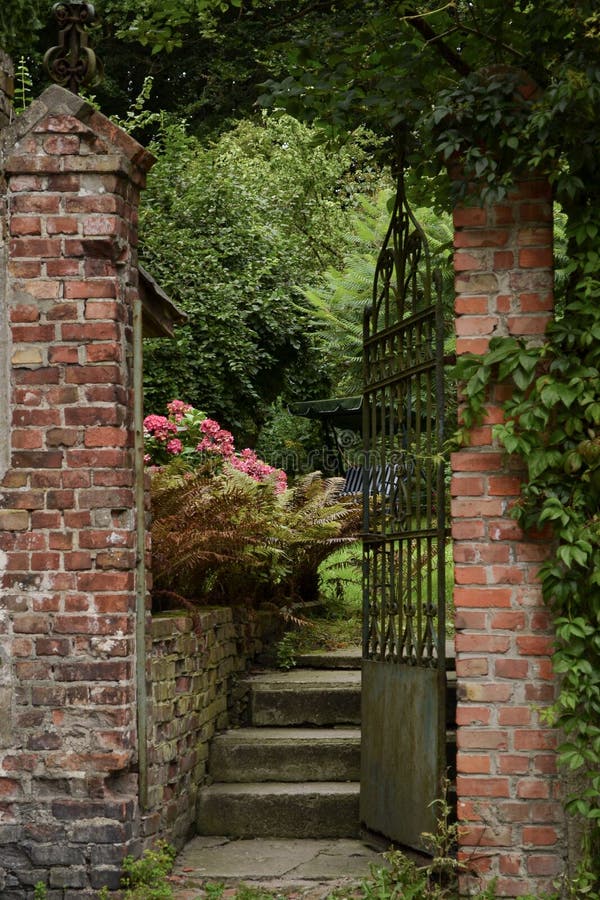 View of the Garden through an Open Wrought Iron Gate Stock Photo ...