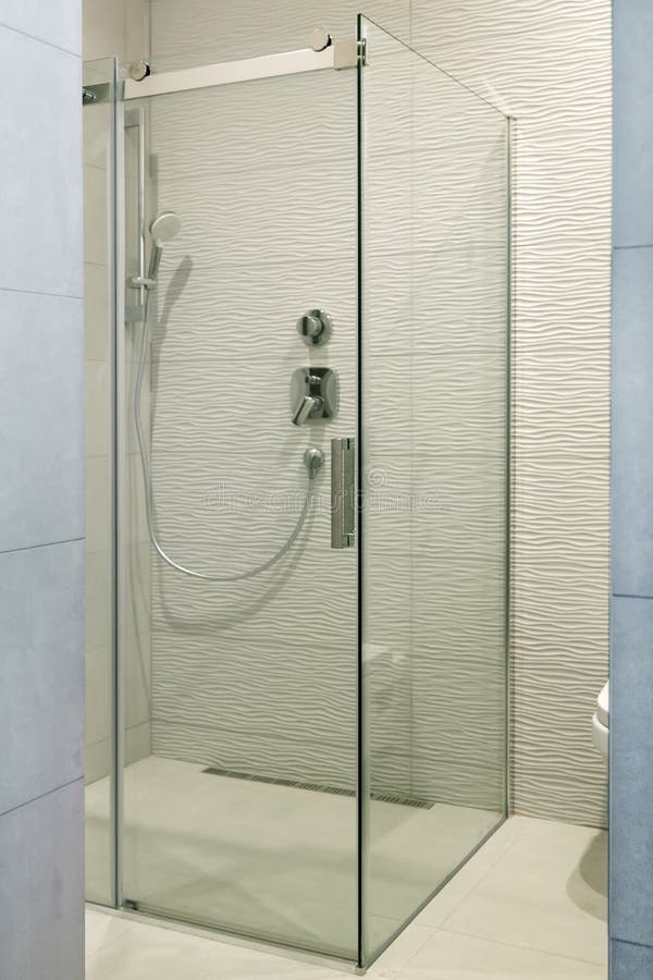 View of Glass Shower Corner with Shower Head on One Wall and Hidden ...
