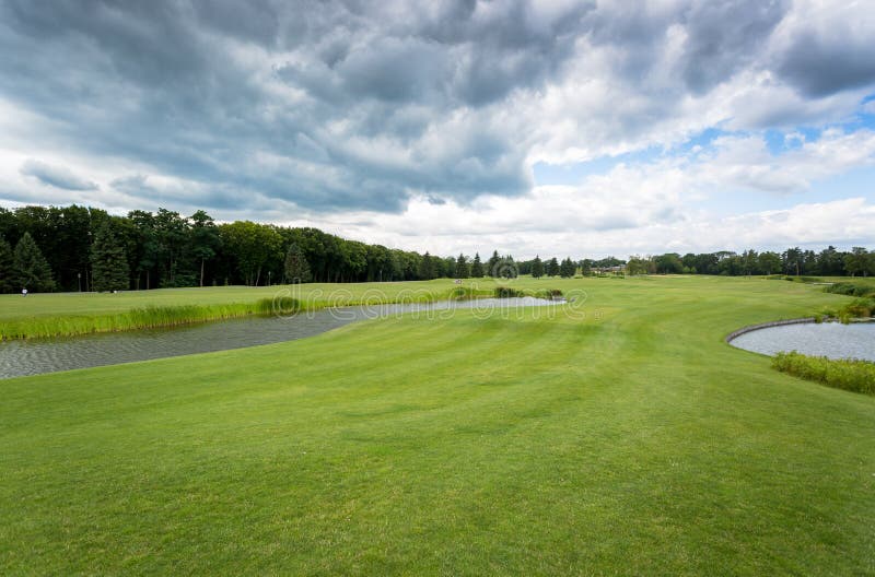 View on Golf Course at Cold Day with Rainy Clouds Stock Photo - Image ...