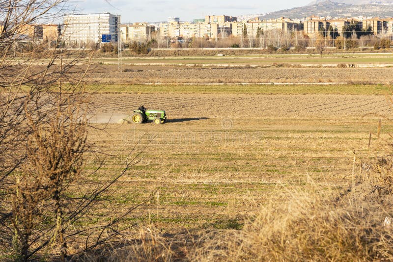 View of the Granada Plain with a Tractor Plowing Stock Photo - Image of ...