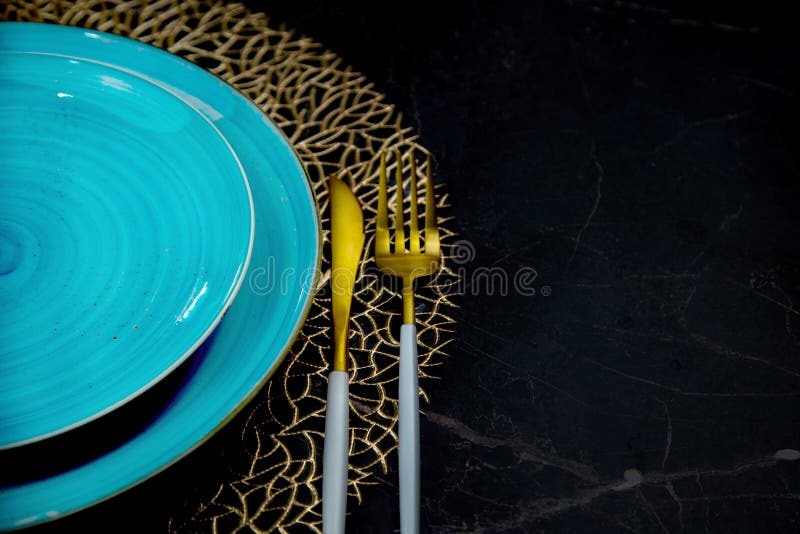 A View of Half of the Blue Plates are Standing One on One on a Gold ...