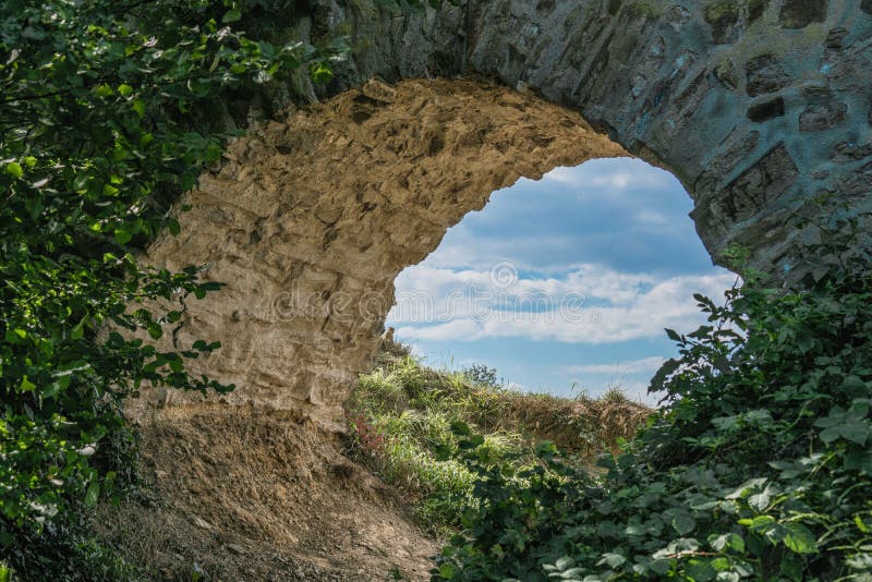 View through the Half-buried Passage through a Castle Wall Against the ...