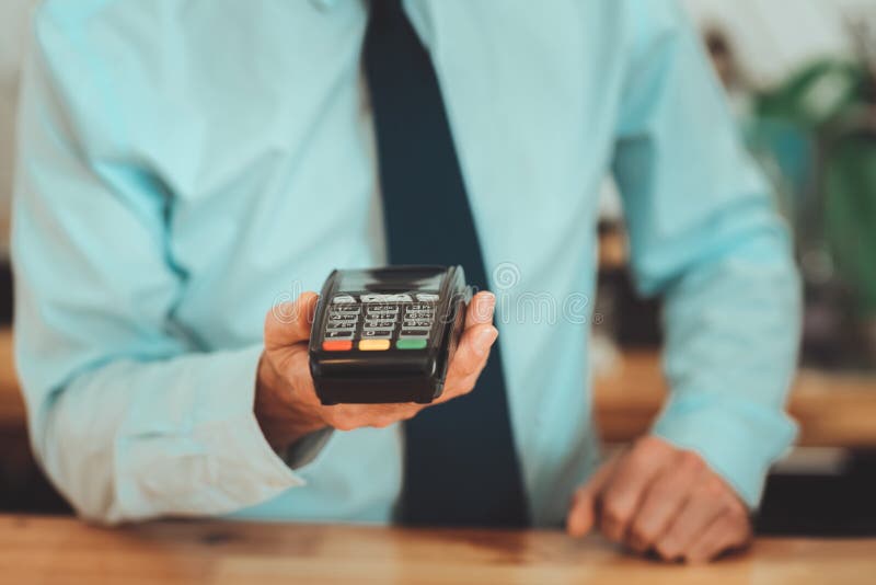 View of Hand Holding a Payment Terminal Stock Image - Image of barista ...