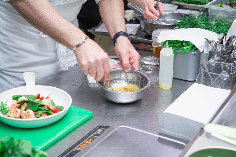 View of the Hands of the Cook Who Prepares the Sauce Stock Image ...