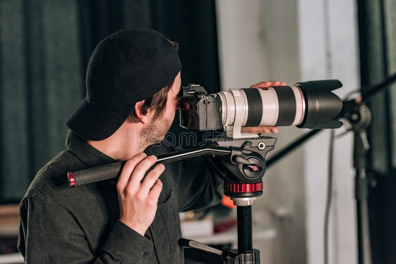 View of Handsome Videographer with Camera on Tripod in Photo Studio ...