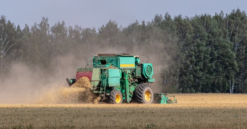 View of Harvester Cutting Wheat, Collecting Grain Stock Photo - Image ...