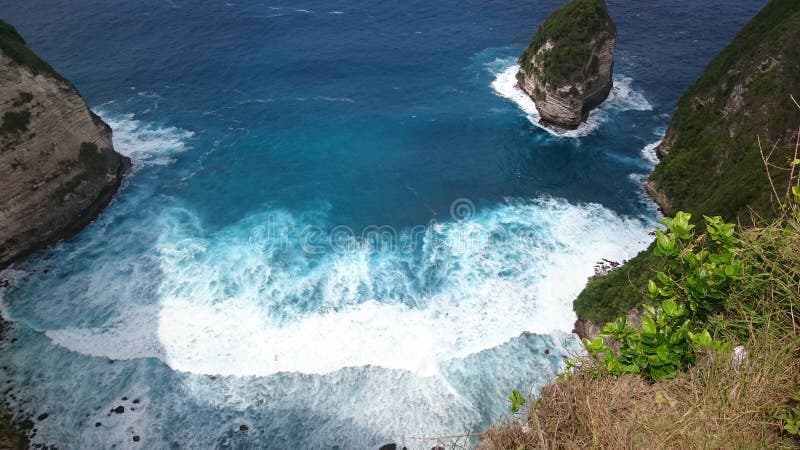 View of a High Cliff and Deep Blue Water. White Waves Stock Photo ...