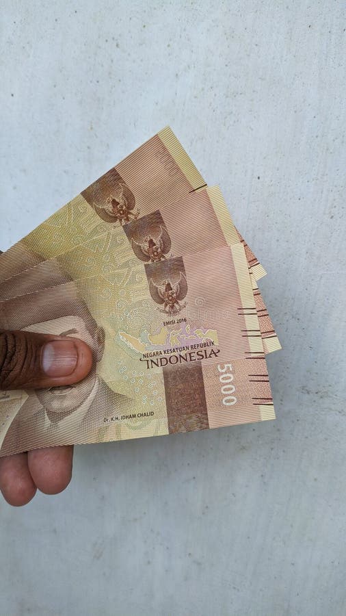 View Indonesia bank notes stock image. Image of hand - 291445079