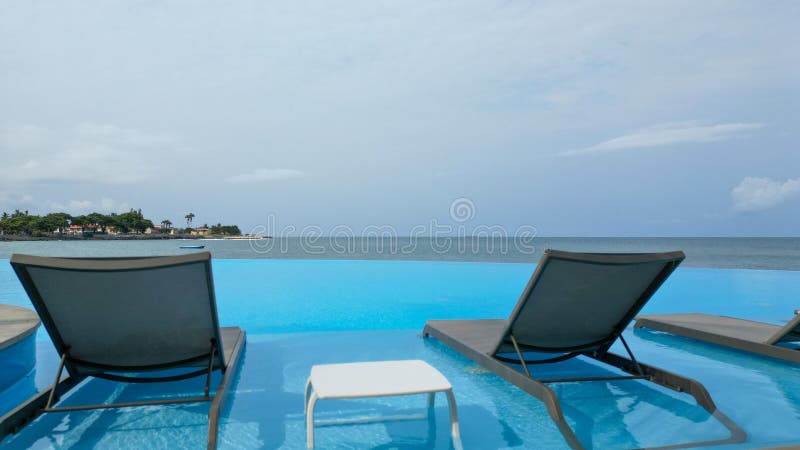 View of Infinity Pool with Chairs and a Table in Sao Tome Stock Image ...