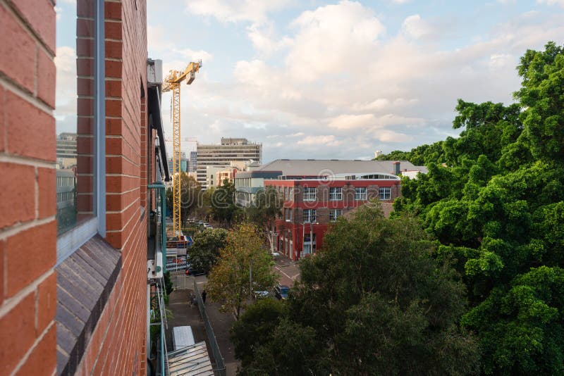 View of Inner City Buildings with a Crane Stock Photo - Image of city ...