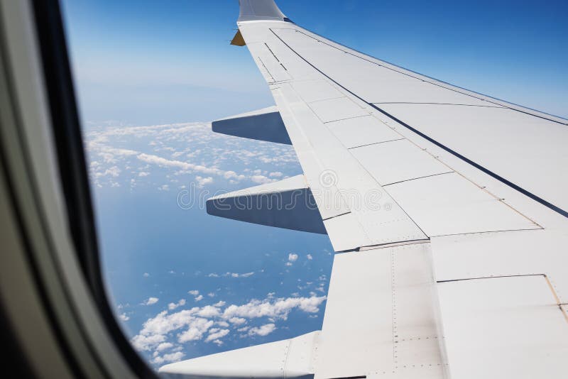 View from Inside an Aircraft: Window of the Cabin, White Airplane Wing ...