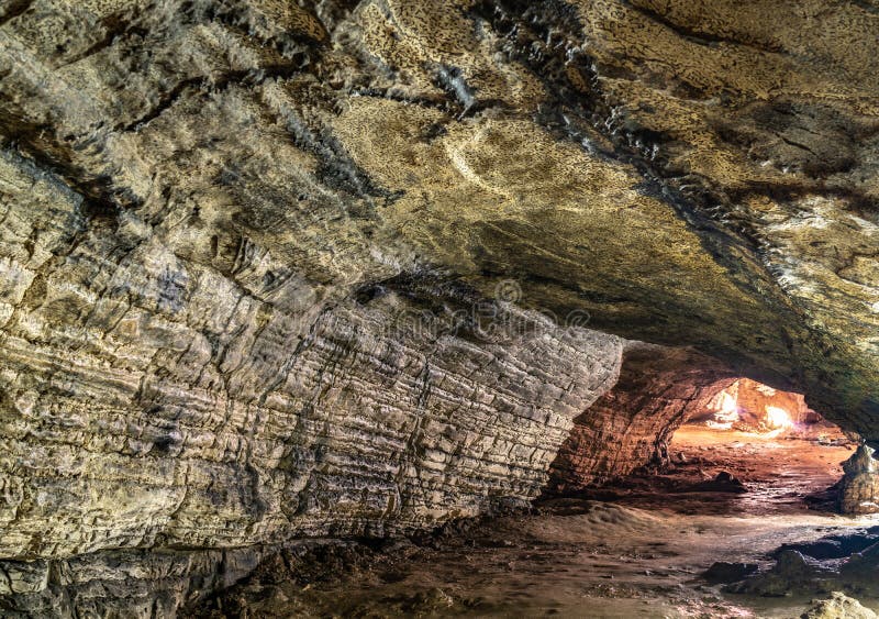 View Inside the Ancient Cave with Stone Walls with Additional Lighting ...