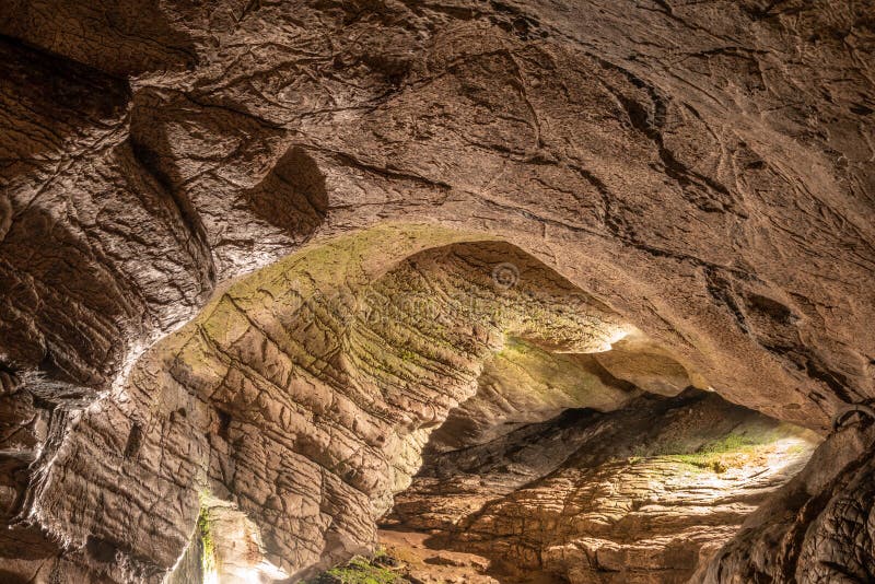 View Inside the Ancient Cave with Stone Walls with Additional Lighting ...