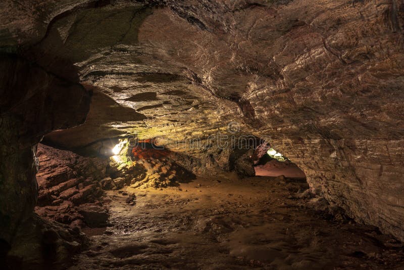 View Inside the Ancient Cave with Stone Walls with Additional Lighting ...