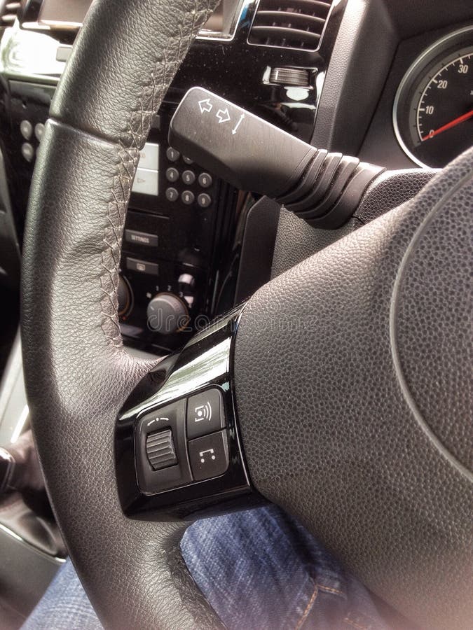A View of the Inside of a Car Interior Featuring Part of the Steering ...