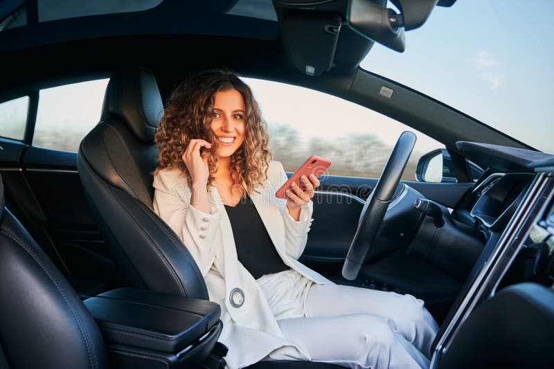 Woman with Phone Resting while Car Autopilot Driving. Stock Image ...