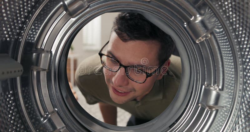 View from Inside the Drum, a Man Has Bought a New Washing Machine ...