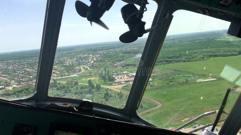 View from Inside of Helicopter Cockpit of Meadows and Fields. View from ...