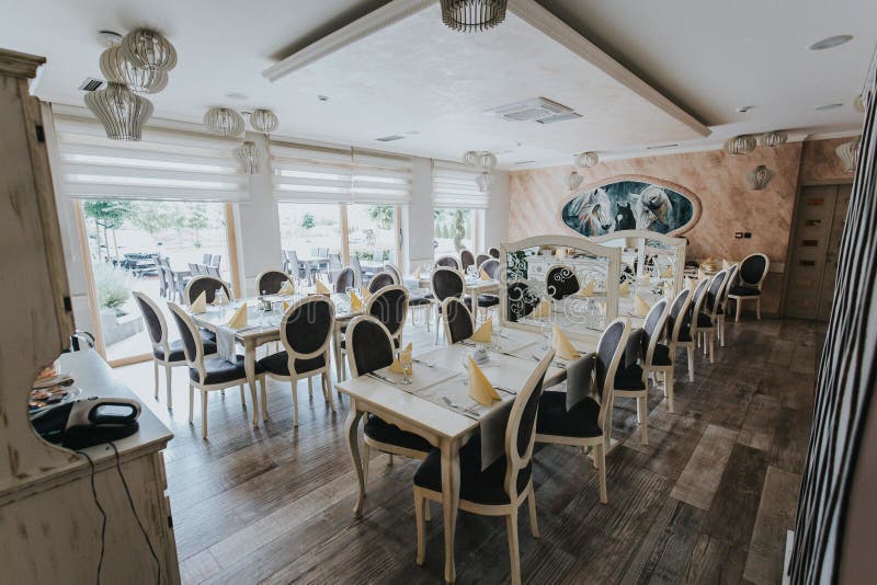 View Inside a Modern Table and Chair Set-up in a Restaurant Stock Image ...