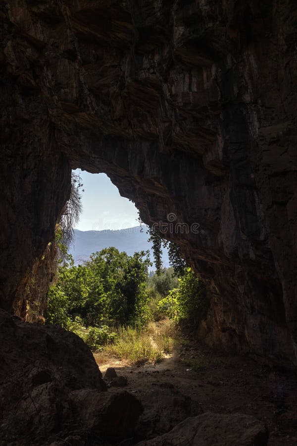 View from Inside the Natural Cave. Landscape Vista through Rocks Stock ...