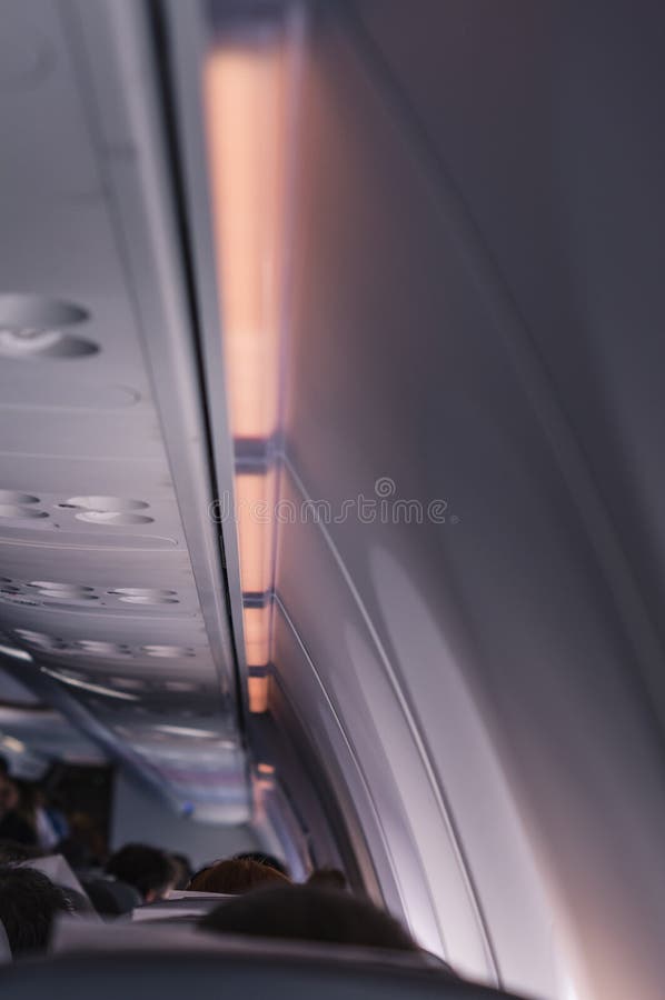 View Inside a Passenger Plane in Flight Stock Photo - Image of crowded ...