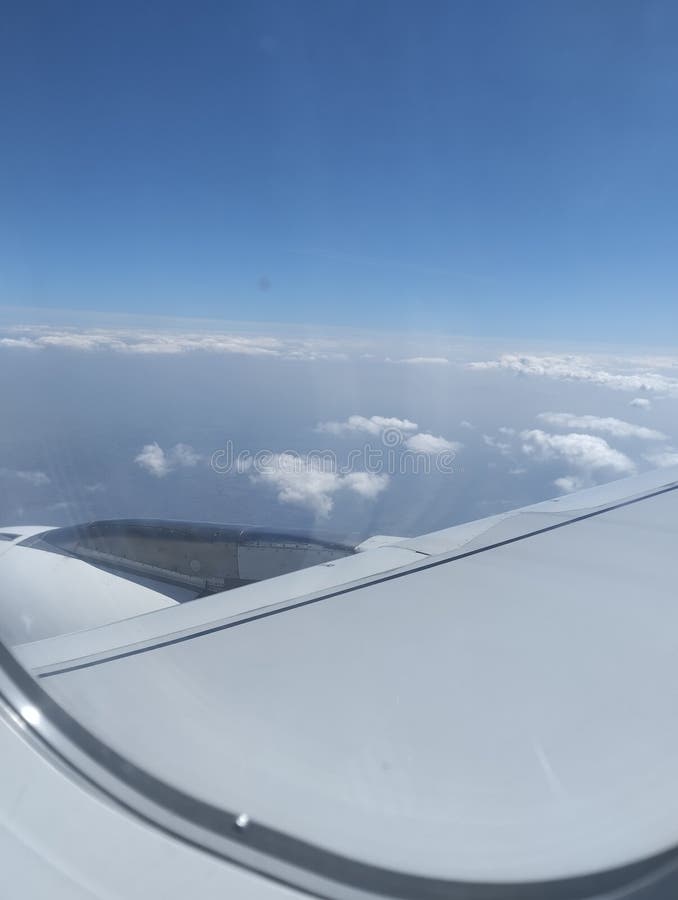 View Inside the Plane Above the Clouds with a Blue Sky on a Bright Morning Stock Image - Image ...