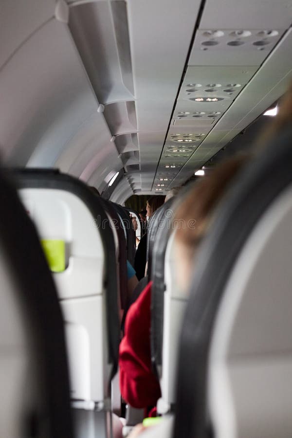 A View Inside the Plane between Rows of Seats. the Concept of Rest and ...