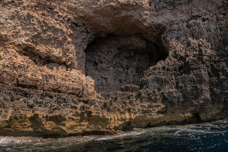 View Inside the Rocks on the Island of Gozo - Malta Stock Photo - Image ...