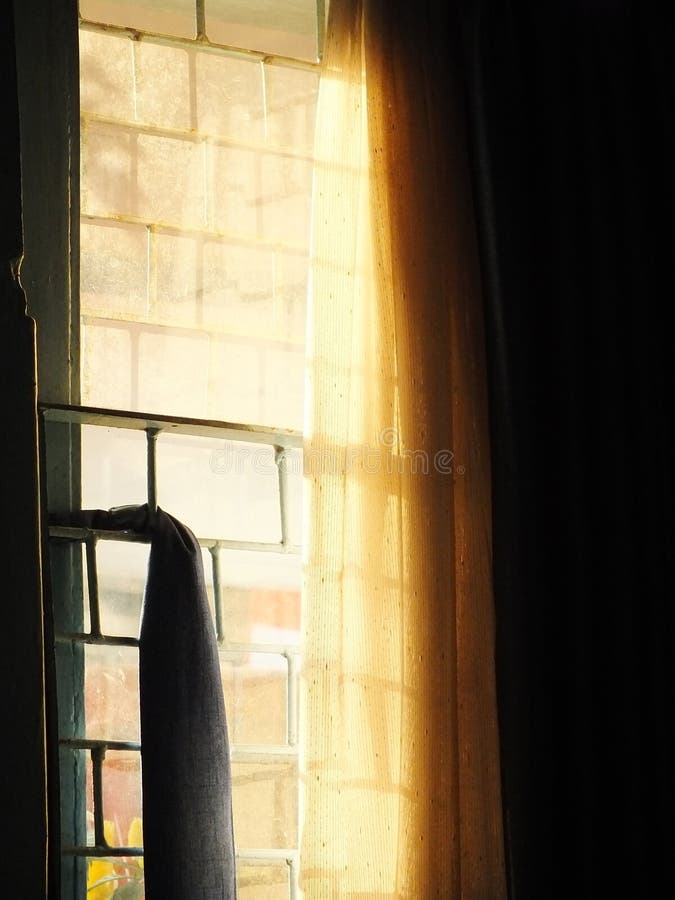 View from Inside Room, Looking Outside through a Window with a Curtain ...