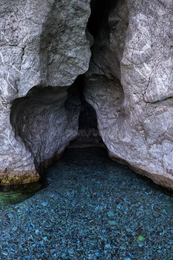 A Small Cave on Traganou Beach Stock Image - Image of bedrock, wadi ...
