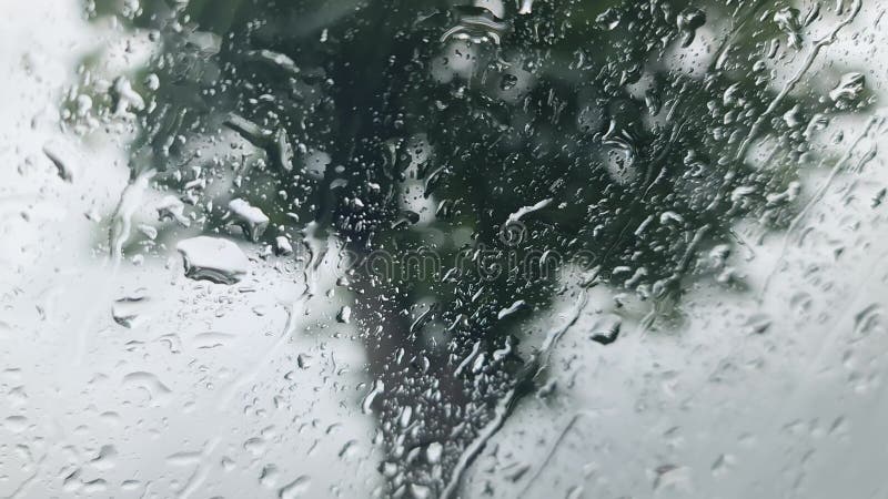 View from Inside the Windscreen of a Car in Heavy Rain with Many Drops ...