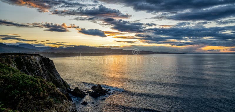 Jagged and Rocky Ocean Coast with Cliffs at Sunset Stock Photo - Image ...