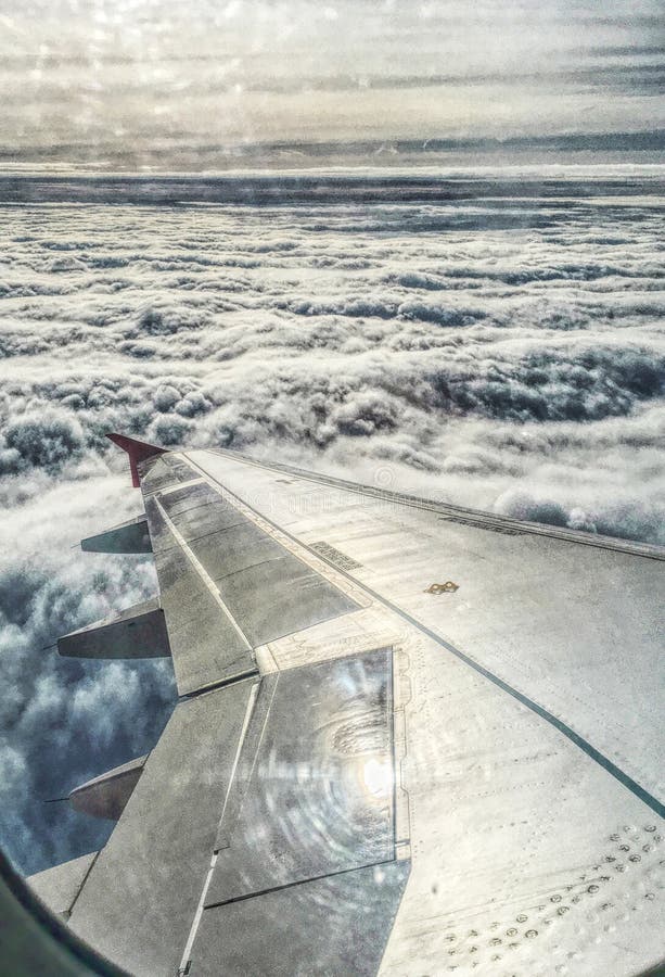 View of Jet Plane Wing Above the Clouds Stock Illustration ...