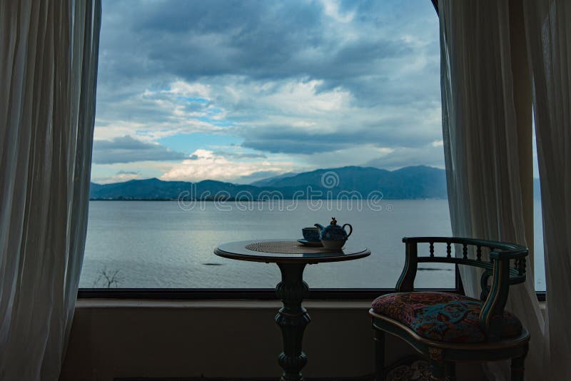 View of a Lake through a Window with a Tea Set on a Table. Stock Photo ...