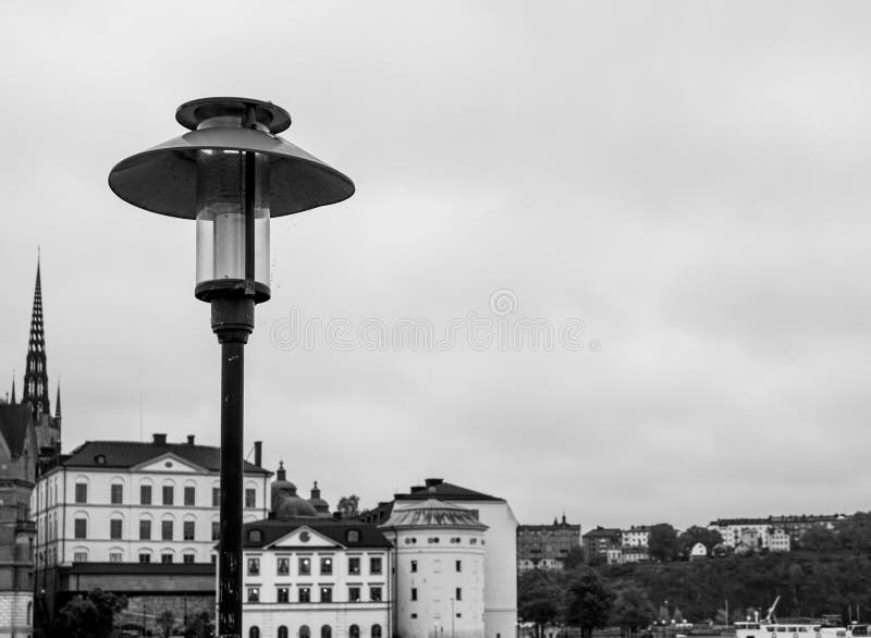 View of a Lamp Post in Front of Buildings Stock Image - Image of spire ...