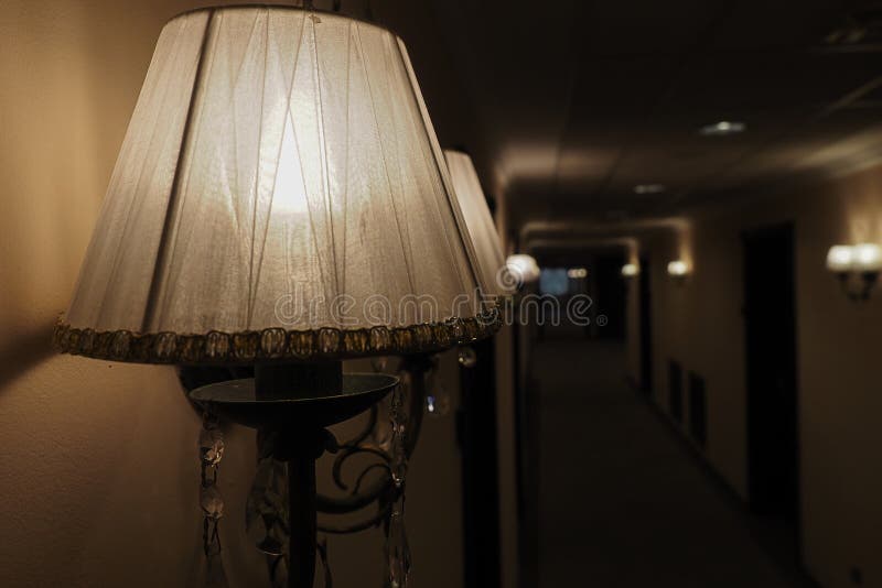 View of Lamp on Wall in Hotel Hallway. Dim Light in Dark Hotel Corridor ...