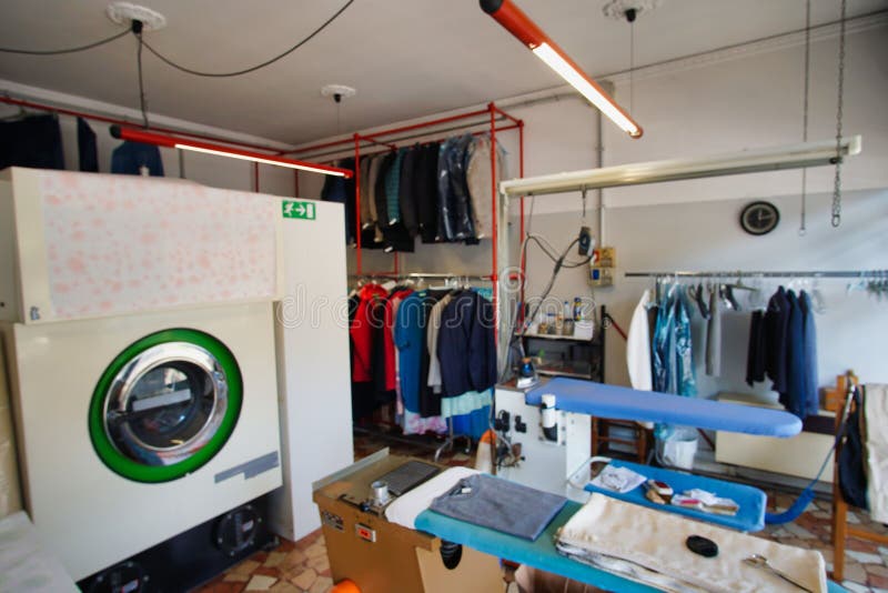 View of Laudry from Inside with Tools, Washing Machine and Iron ...