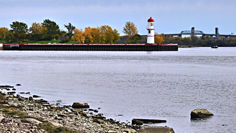 Lighthouse on a dock stock image. Image of vehicle, water - 351225279