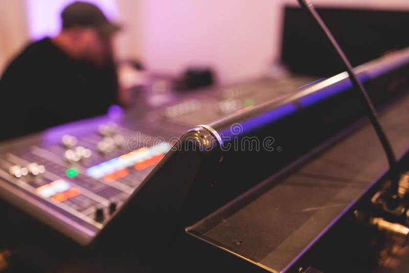 View of Lighting Engineer Operator Working on Mixing Console Workplace ...