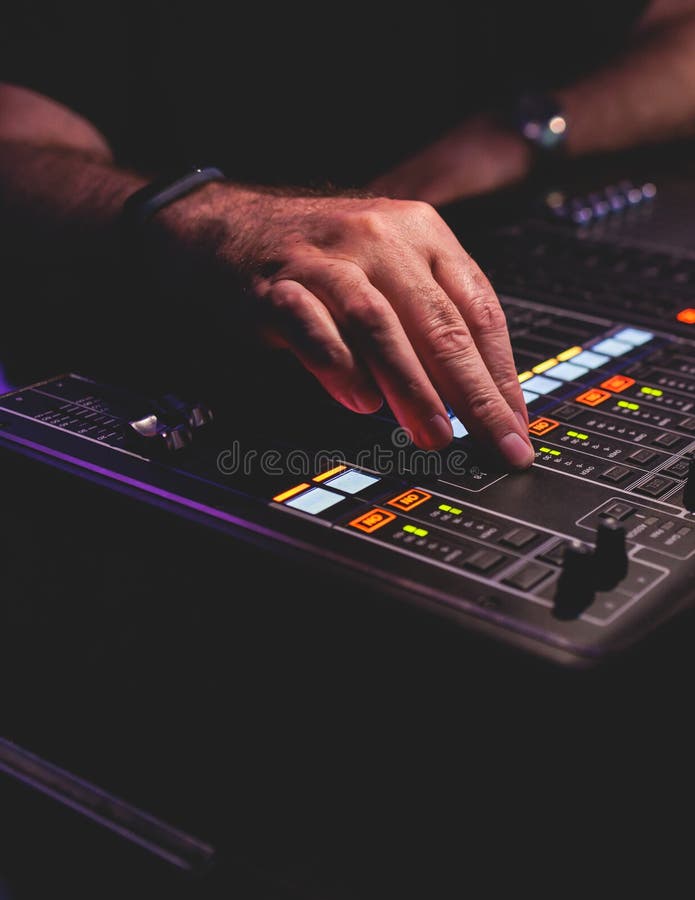 View of Lighting Engineer Operator Working on Mixing Console Workplace ...