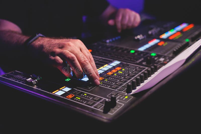 View of Lighting Engineer Operator Working on Mixing Console Workplace ...